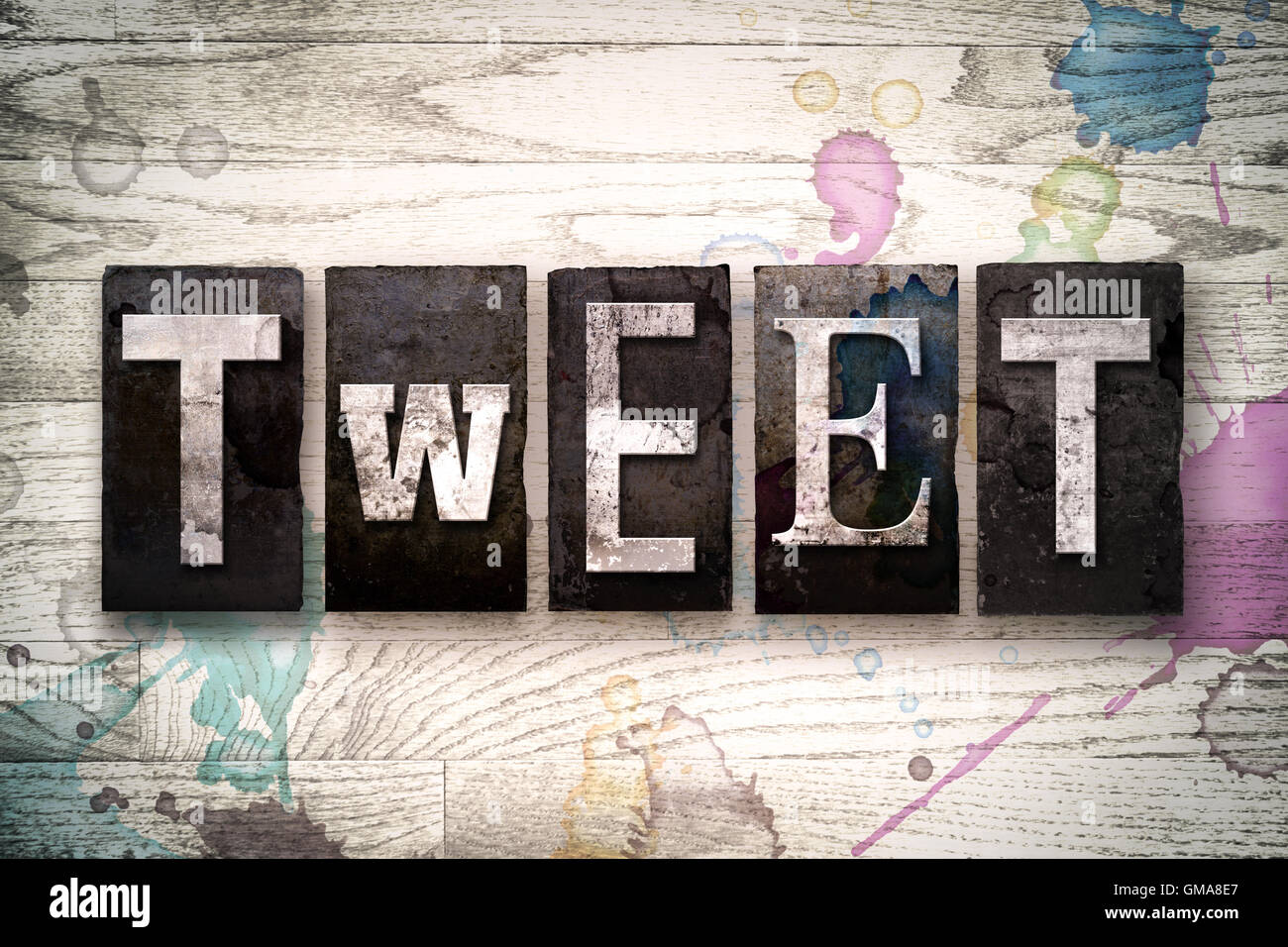 The word "TWEET" written in vintage dirty metal letterpress type on a ...