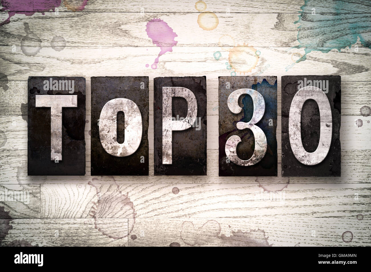 The word "TOP 30" written in vintage dirty metal letterpress type on a ...