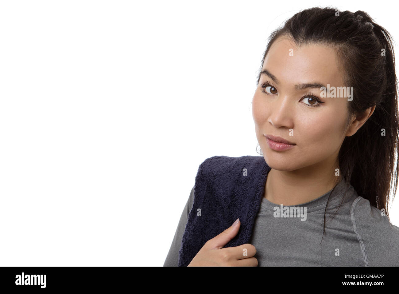 female with a towel over her shoulder Stock Photo - Alamy