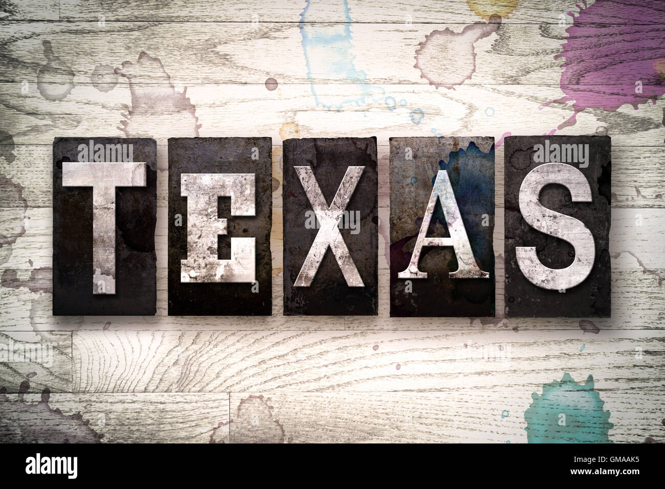 The word "TEXAS" written in vintage dirty metal letterpress type on a ...
