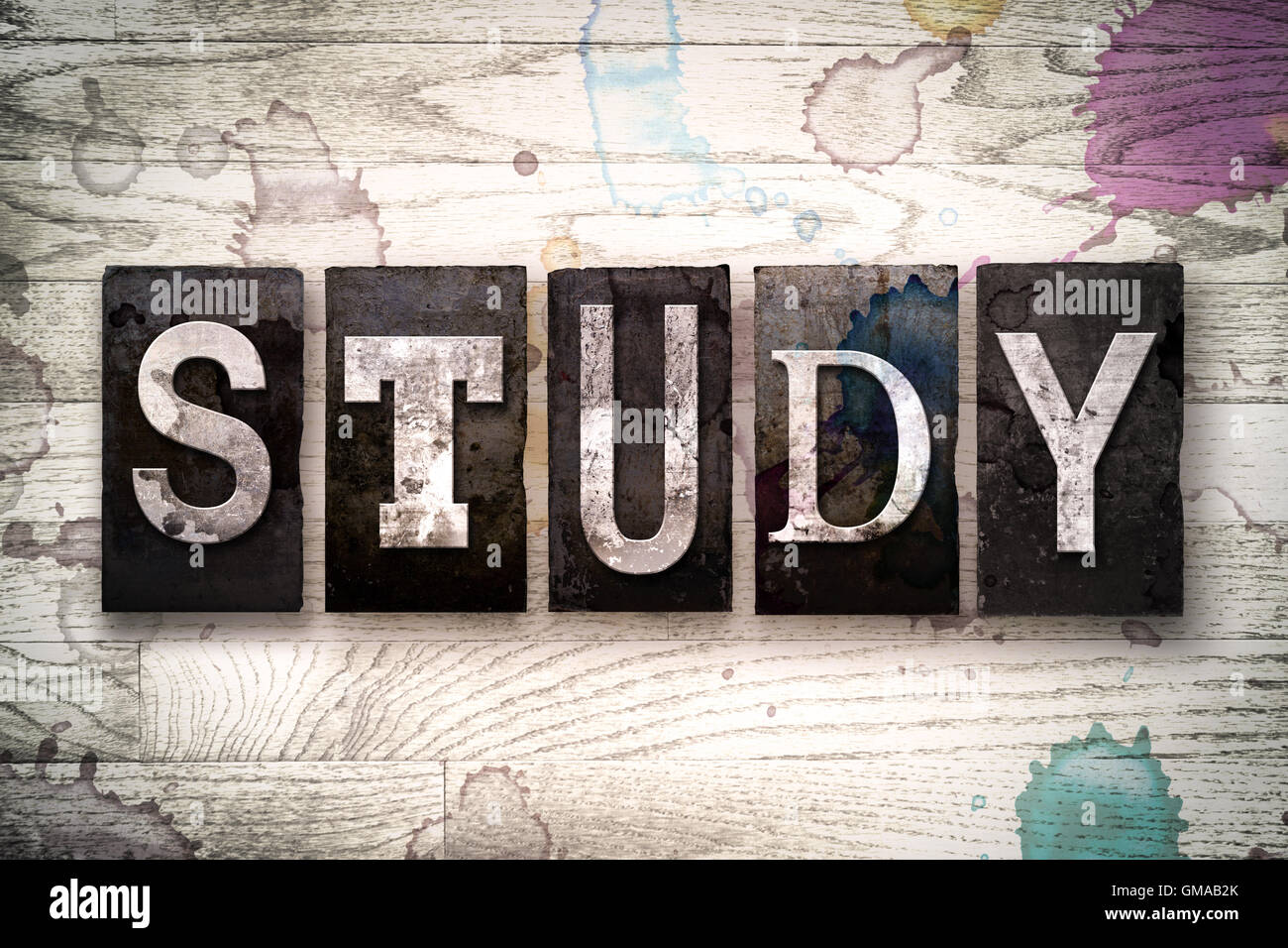 The word "STUDY" written in vintage dirty metal letterpress type on a ...