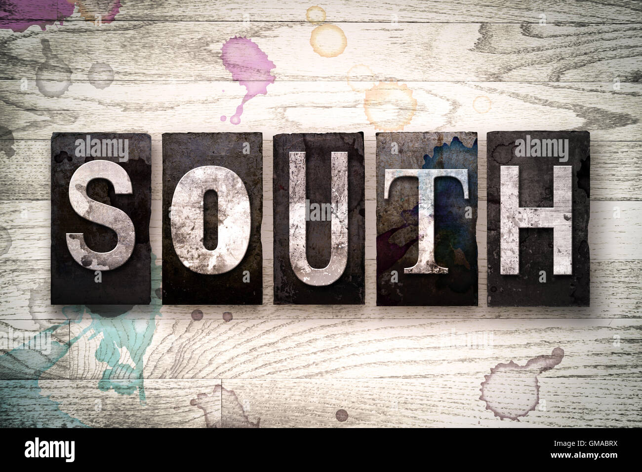 The word "SOUTH" written in vintage dirty metal letterpress type on a ...
