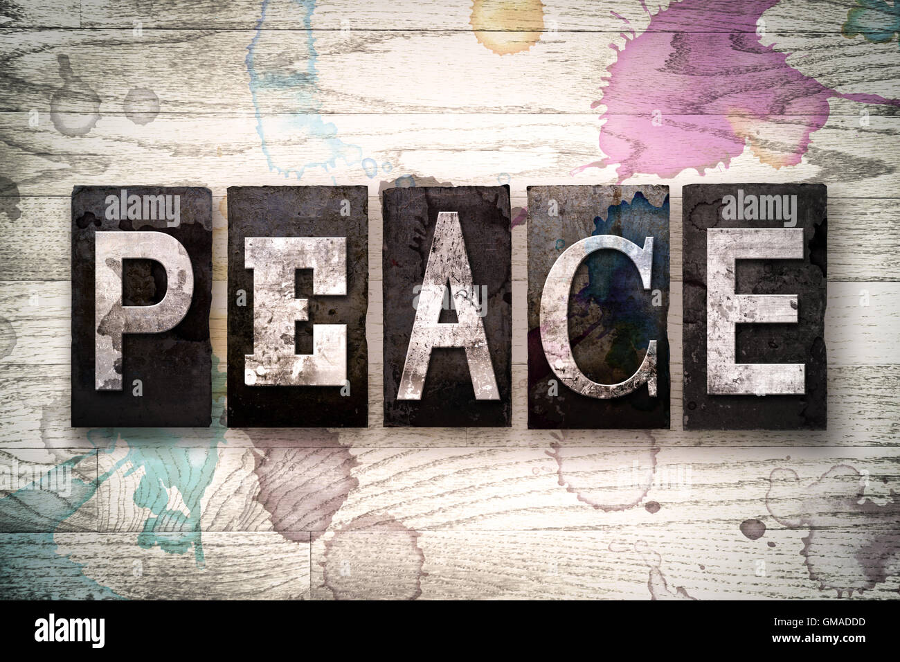 The word "PEACE" written in vintage dirty metal letterpress type on a ...