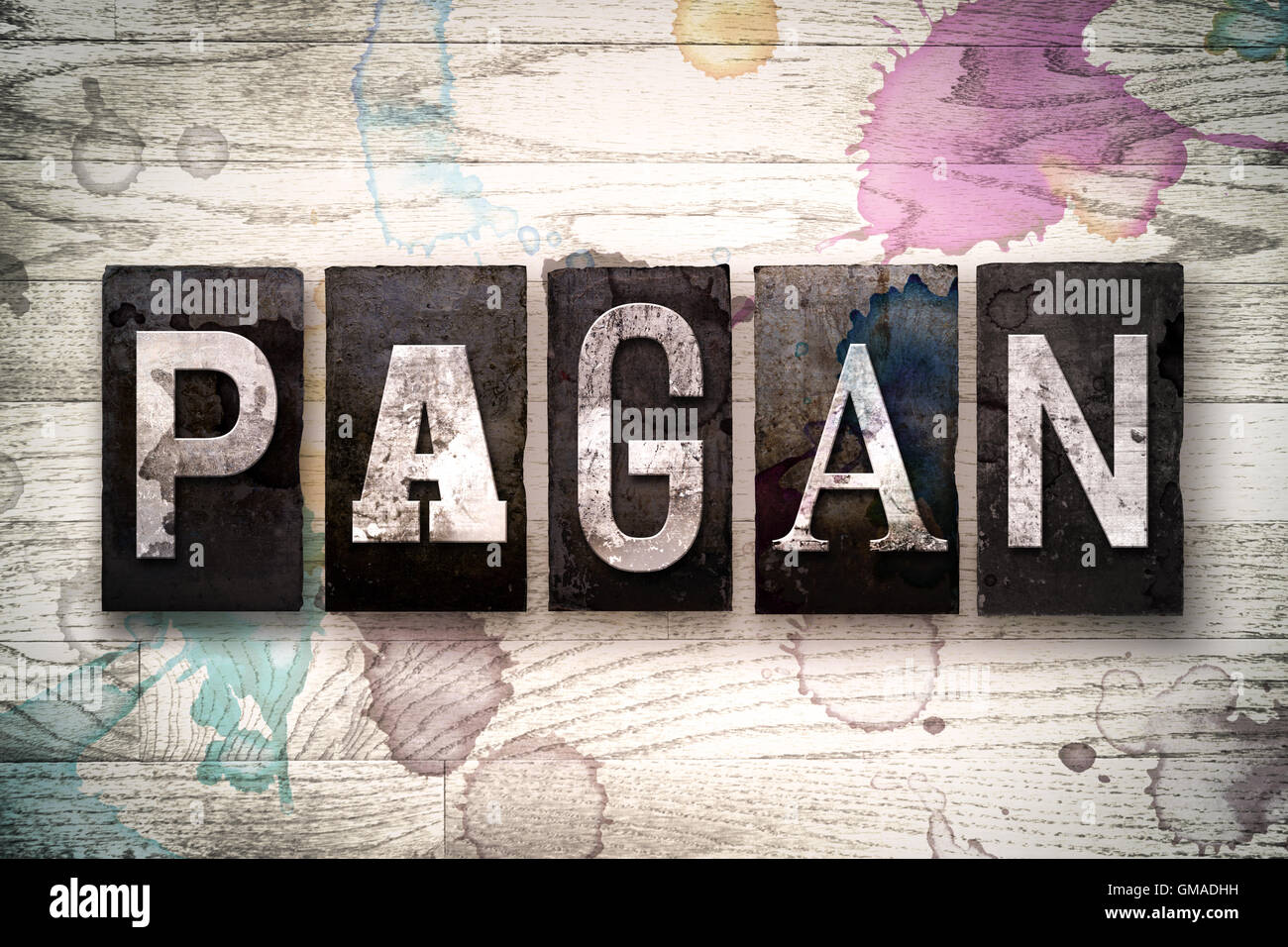 The word "PAGAN" written in vintage dirty metal letterpress type on a ...