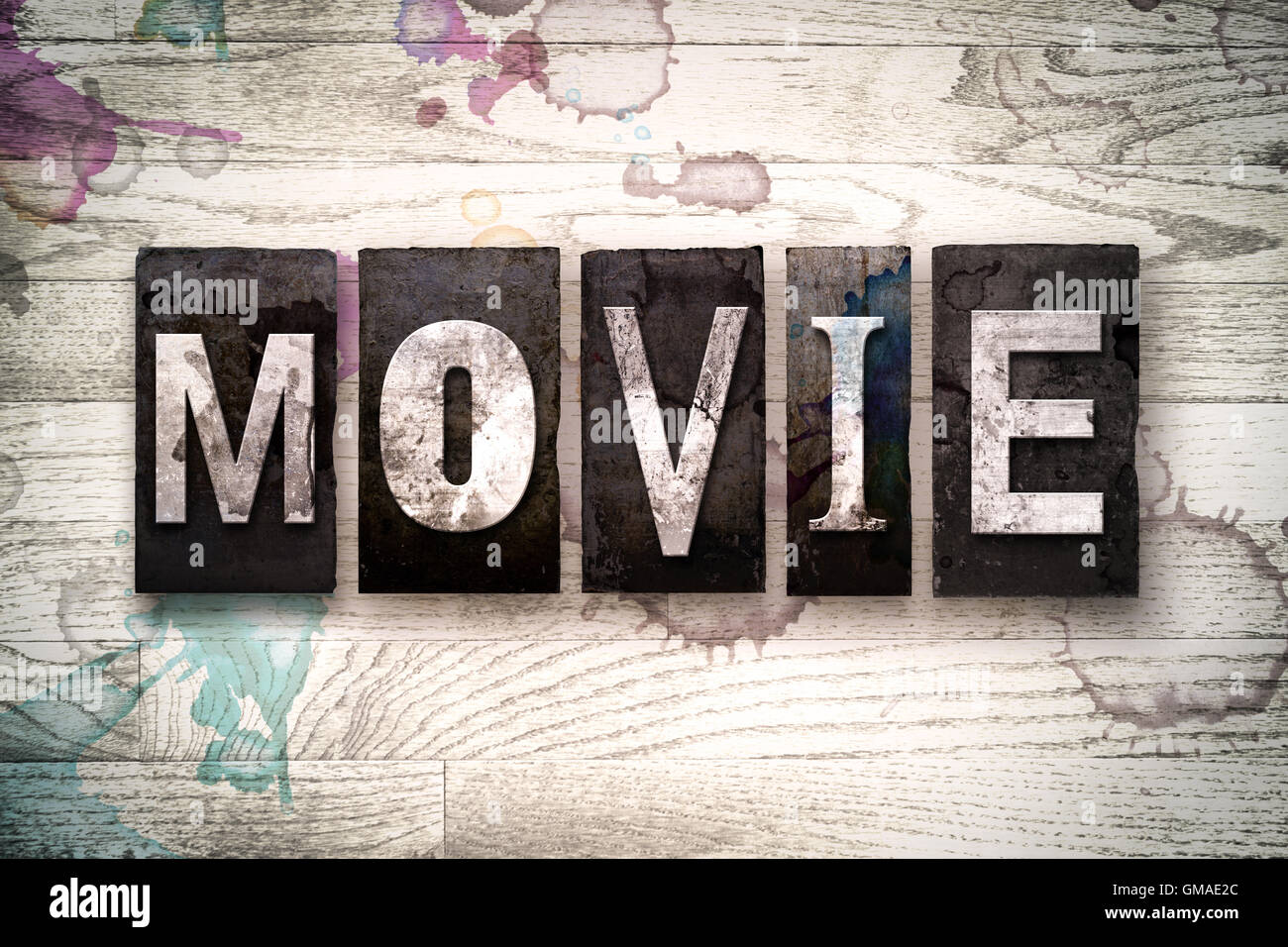 The word "MOVIE" written in vintage dirty metal letterpress type on a ...