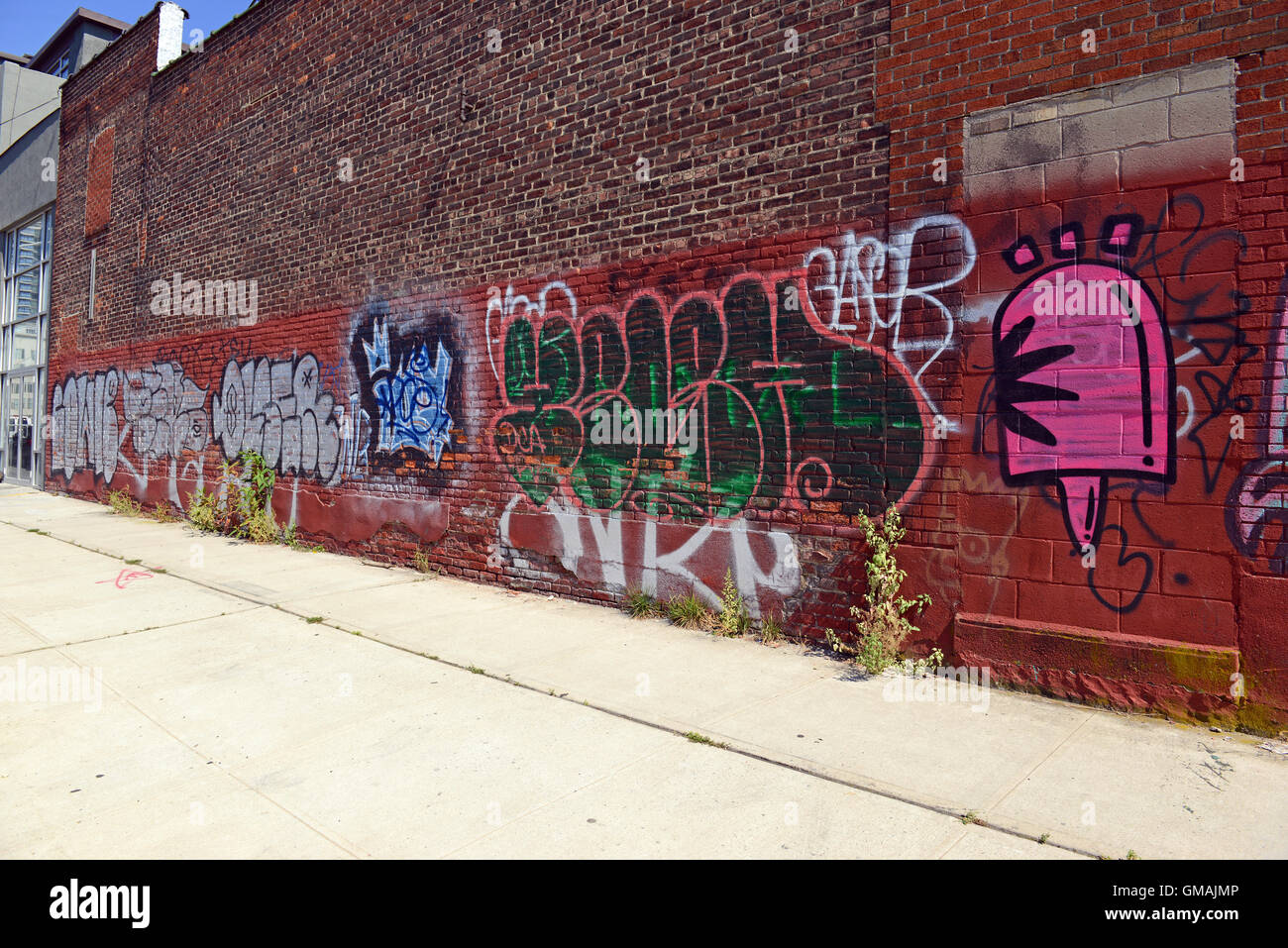 Graffiti shown on a city street Stock Photo - Alamy