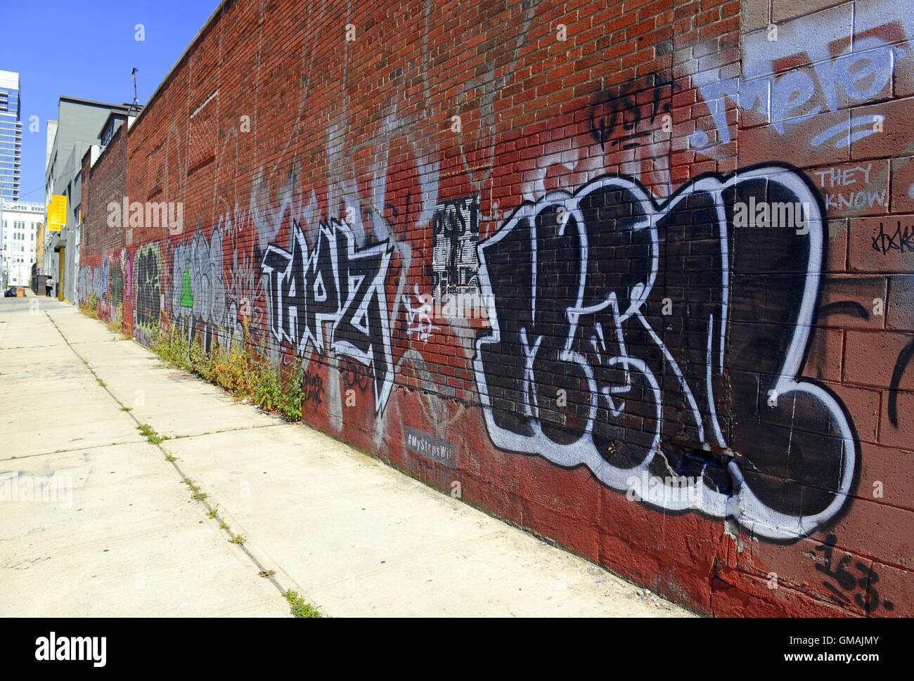 Graffiti shown on a city street Stock Photo - Alamy