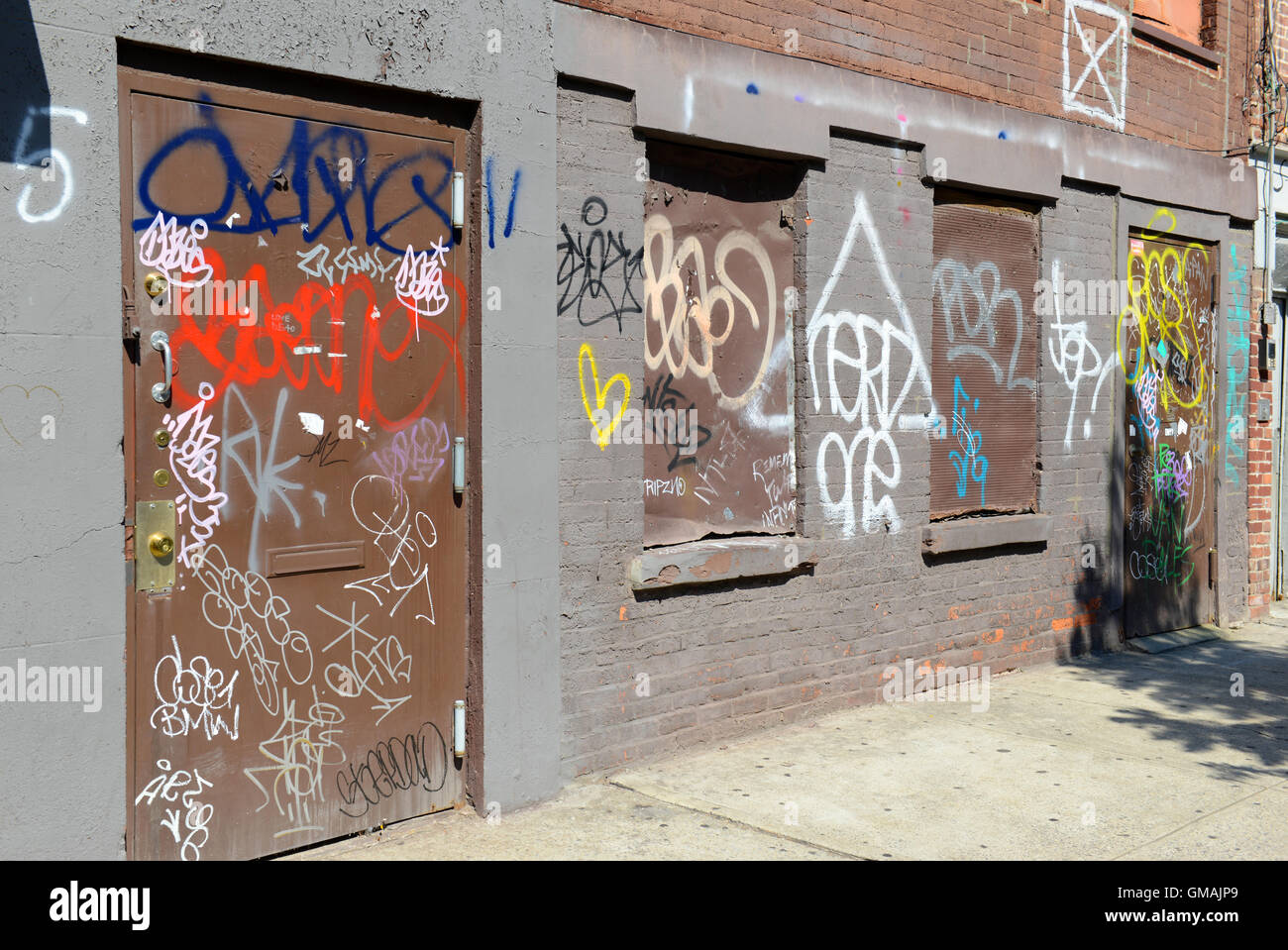 Graffiti shown on a city street Stock Photo - Alamy