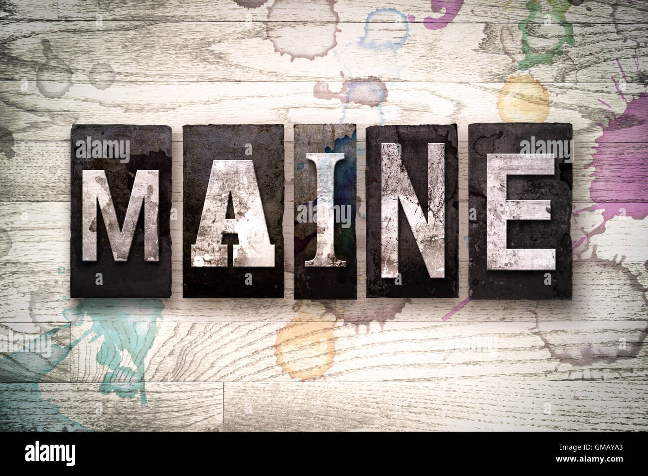 The word "MAINE" written in vintage dirty metal letterpress type on a ...