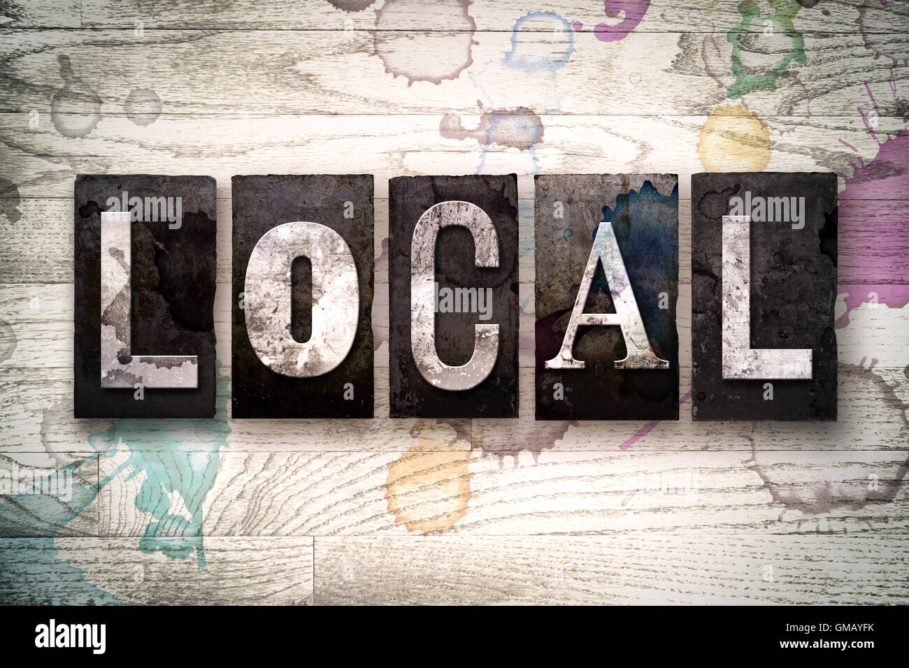 The word "LOCAL" written in vintage dirty metal letterpress type on a ...
