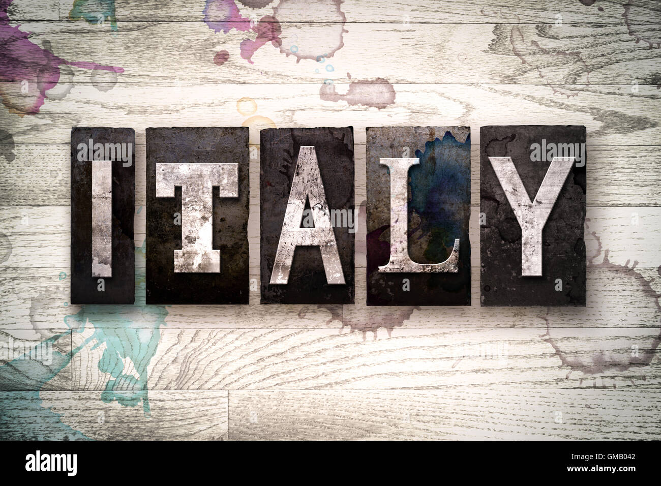 The word "ITALY" written in vintage dirty metal letterpress type on a ...