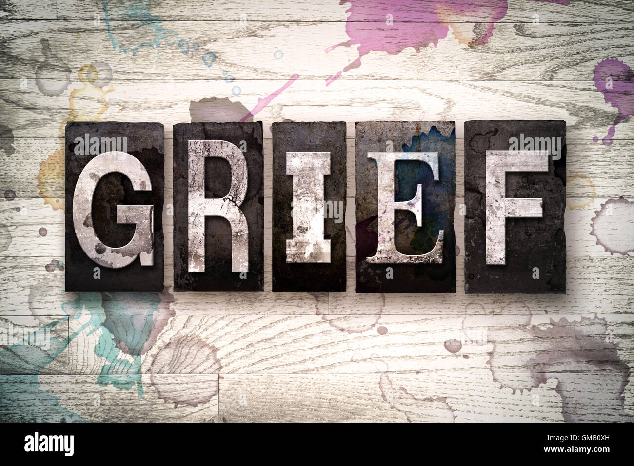 The word "GRIEF" written in vintage dirty metal letterpress type on a ...