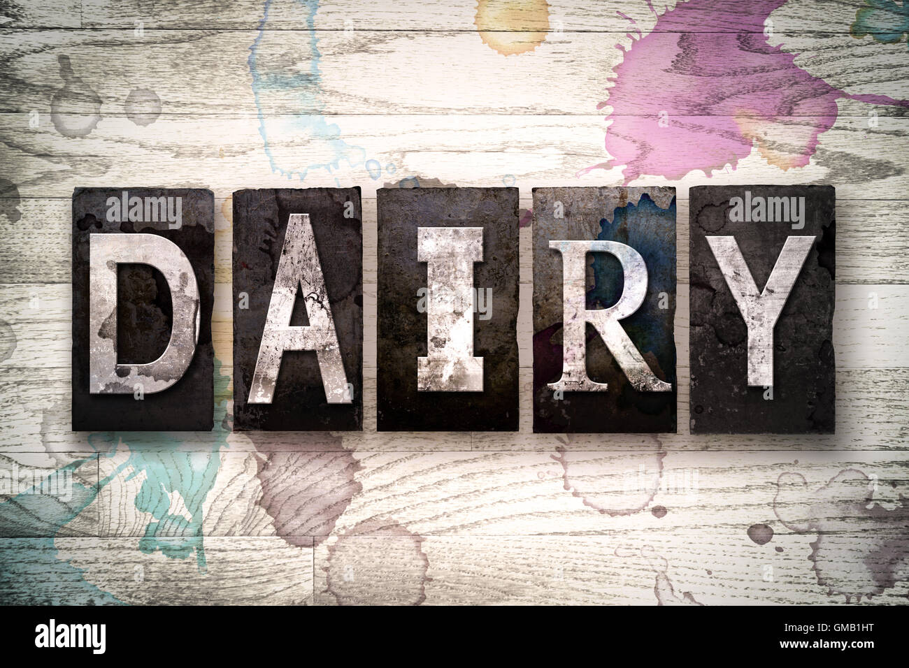 The word "DAIRY" written in vintage dirty metal letterpress type on a ...