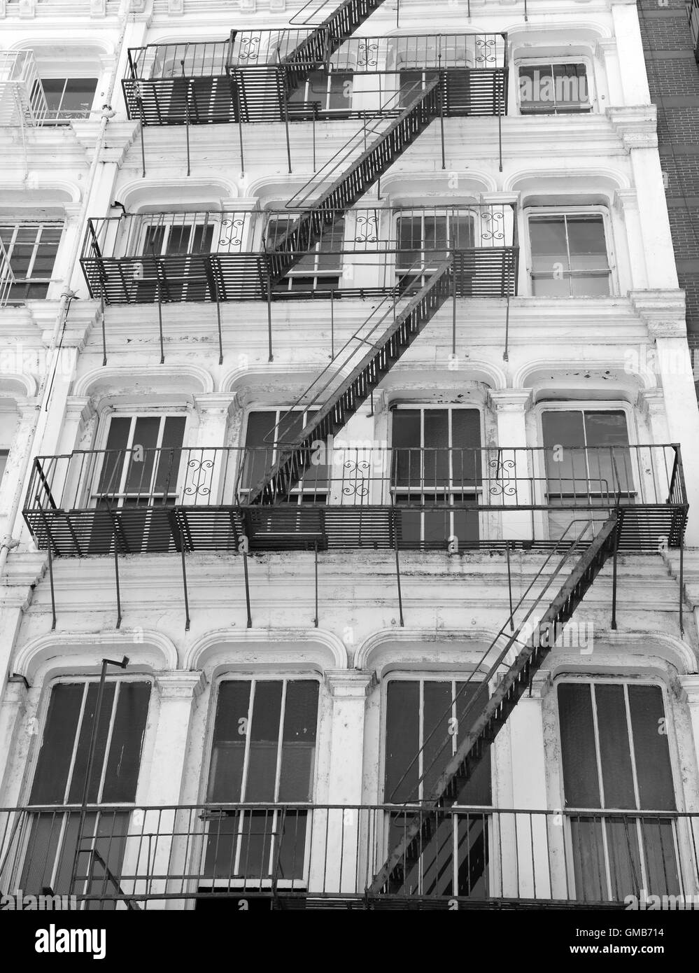 Fire escape on exterior of walk up apartment building in New York City ...