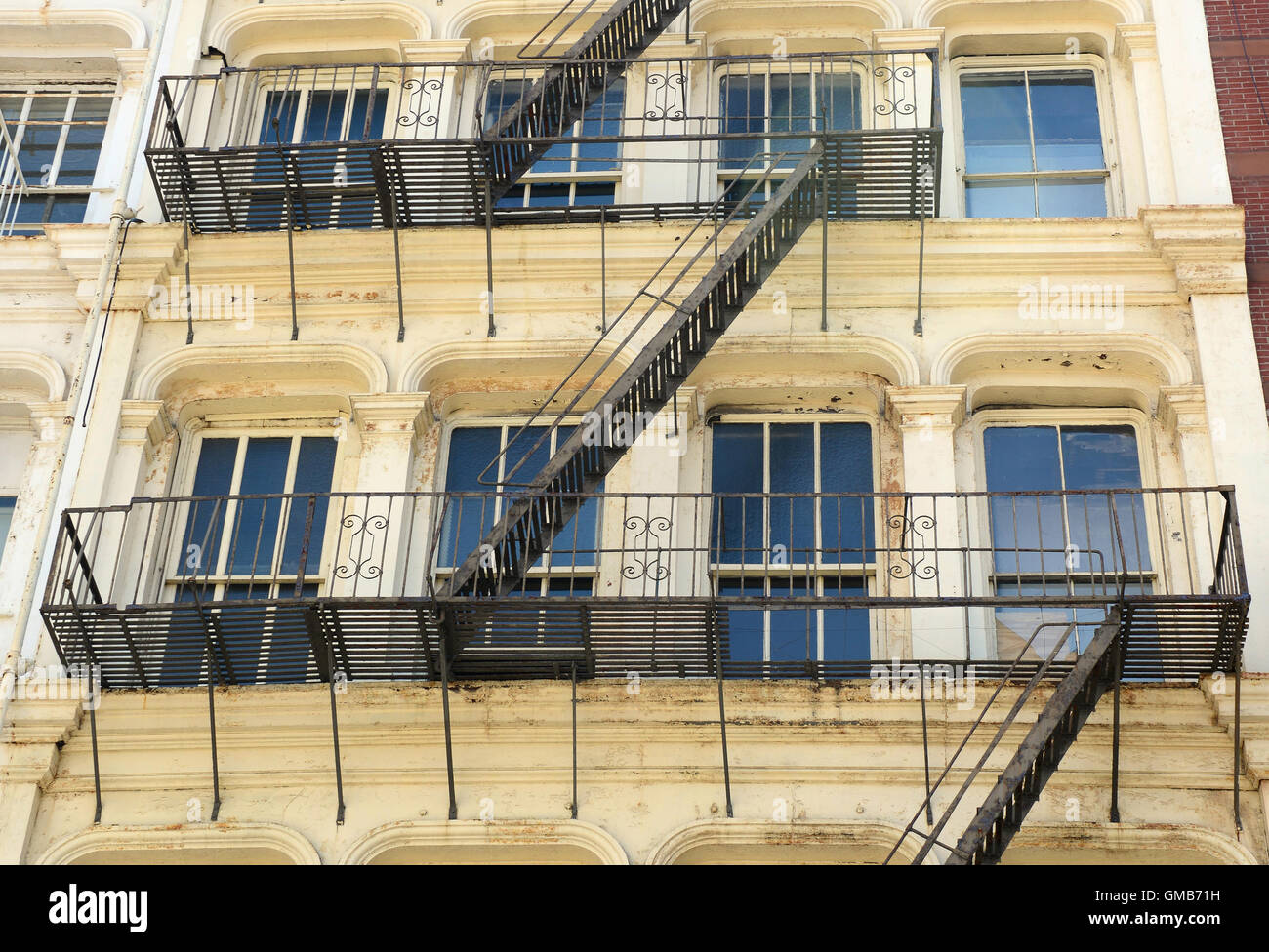 Fire escape on exterior of walk up apartment building in New York City ...