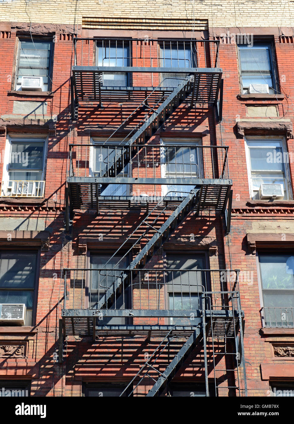 Fire escape on exterior of walk up apartment building in New York City ...