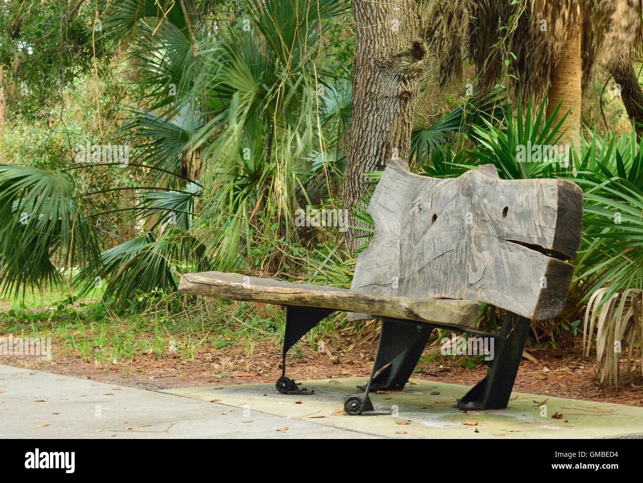 Unique park bench along a walk in a park Stock Photo - Alamy