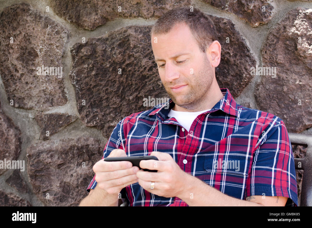 Man on a smartphone playing pokemon go Stock Photo - Alamy