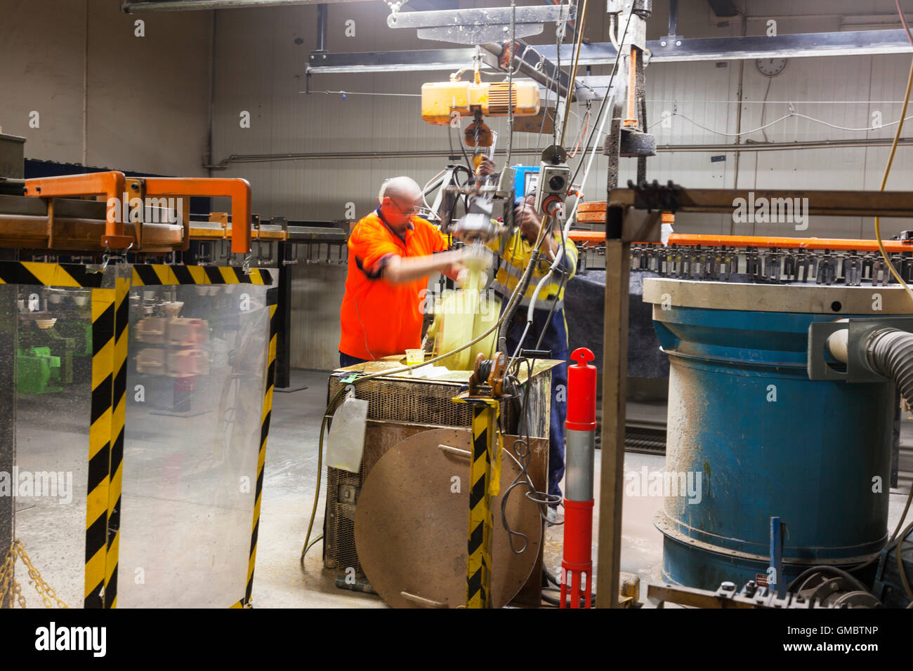 factory workers in a foundery Stock Photo - Alamy