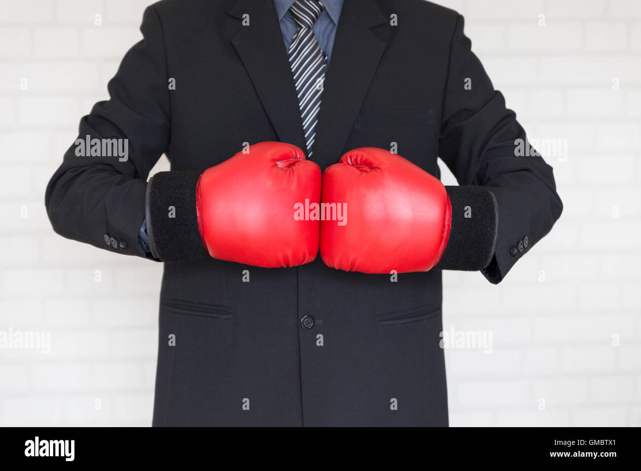 businessman in necktie and suit with red boxing gloves - business ...