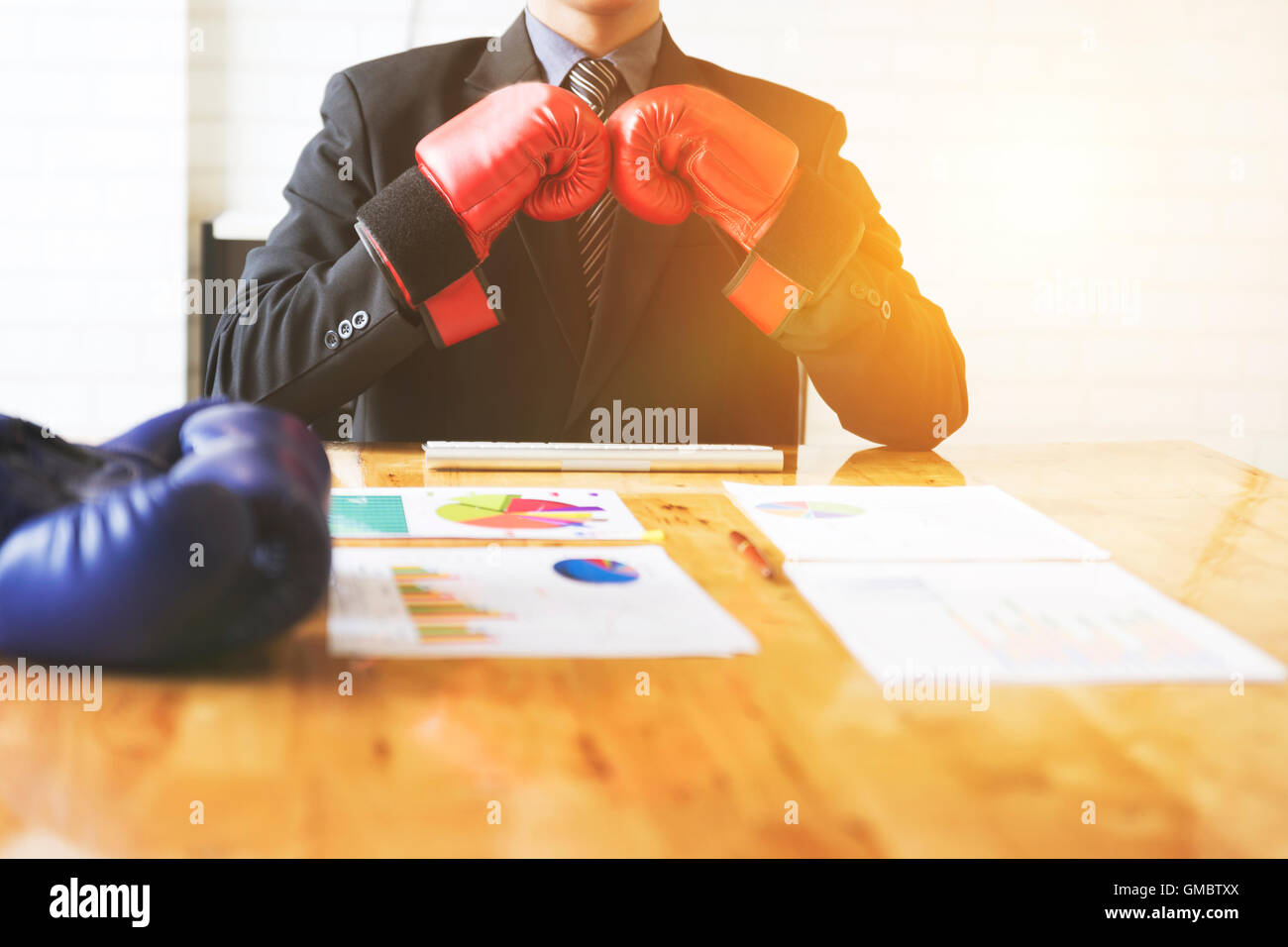 businessman in necktie and suit with red boxing gloves - business ...