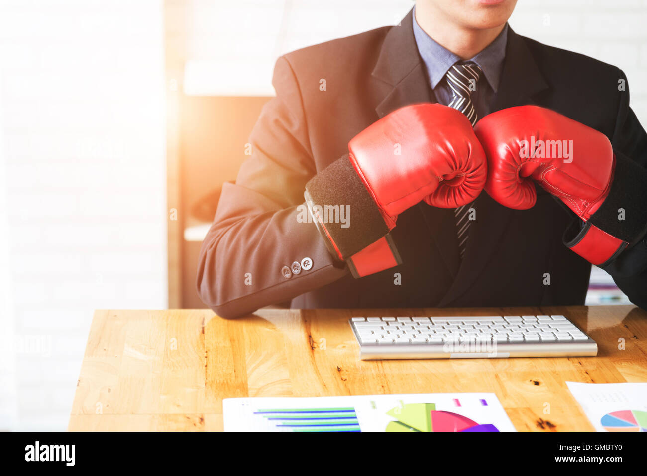 businessman in necktie and suit with red boxing gloves - business ...