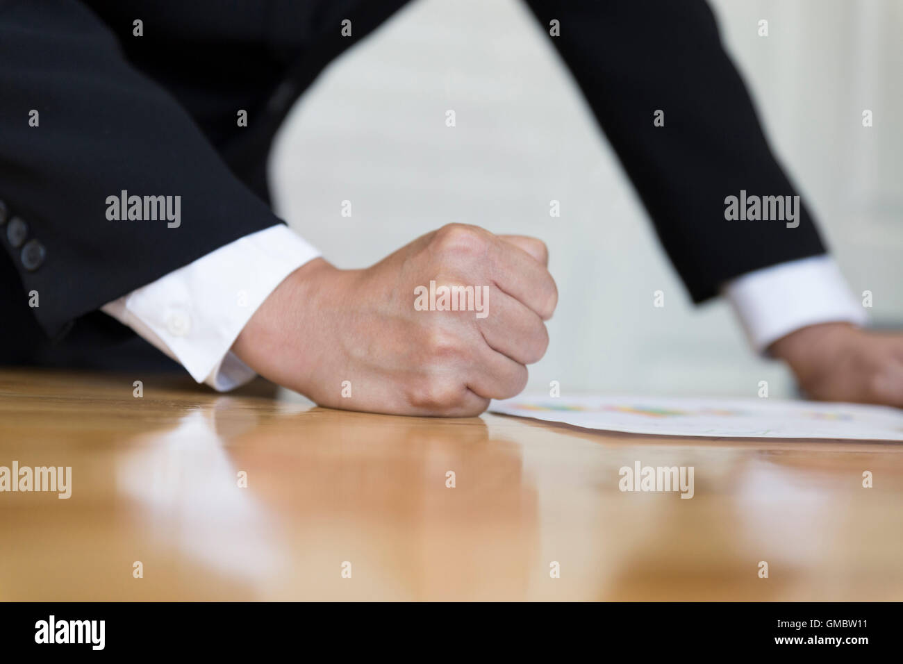 clenched fist of businessman on office desk - angry and furious business concept Stock Photo - Alamy