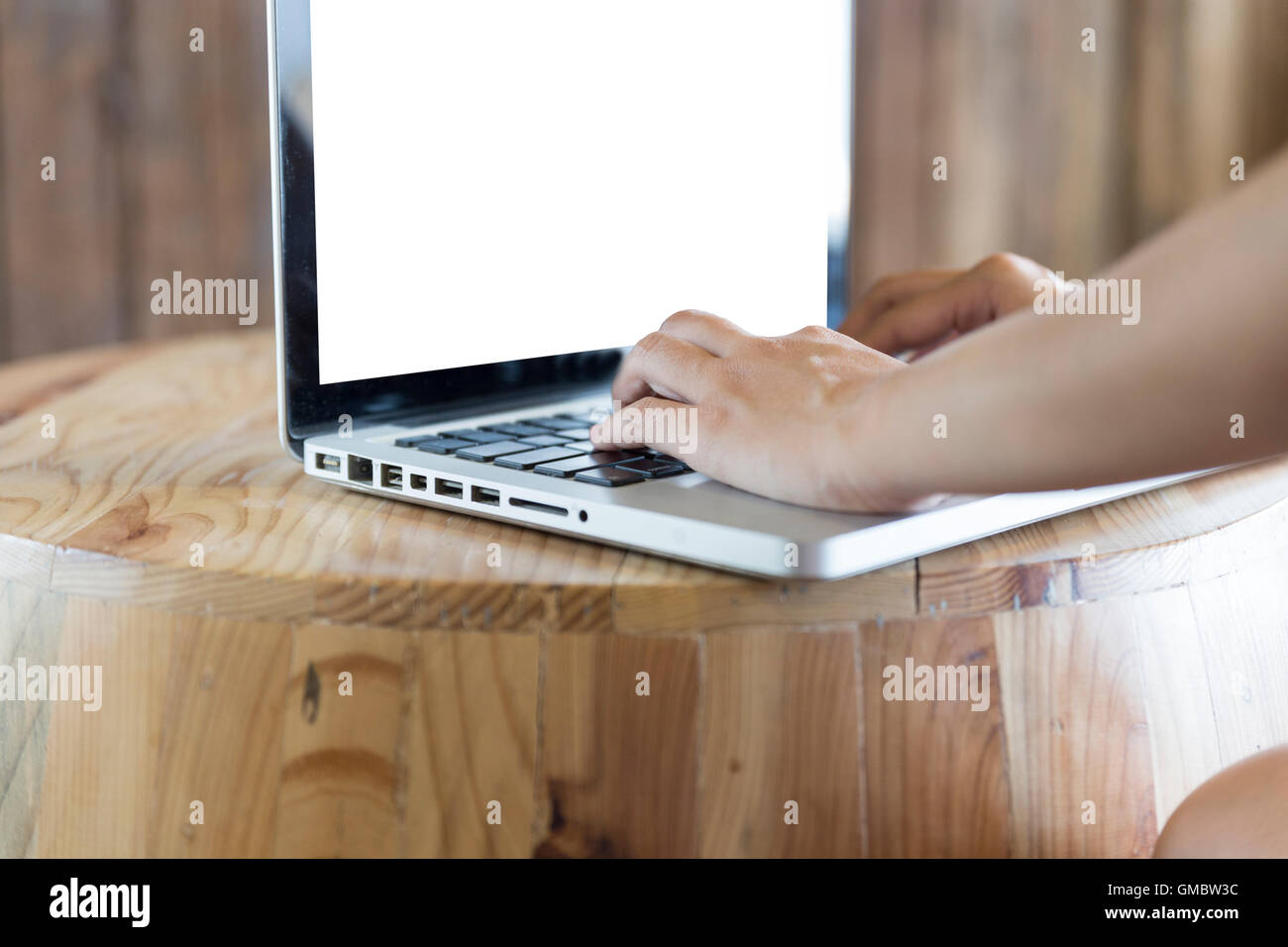 woman's hand on laptop computer notebook on wooden desk in cafe Stock ...