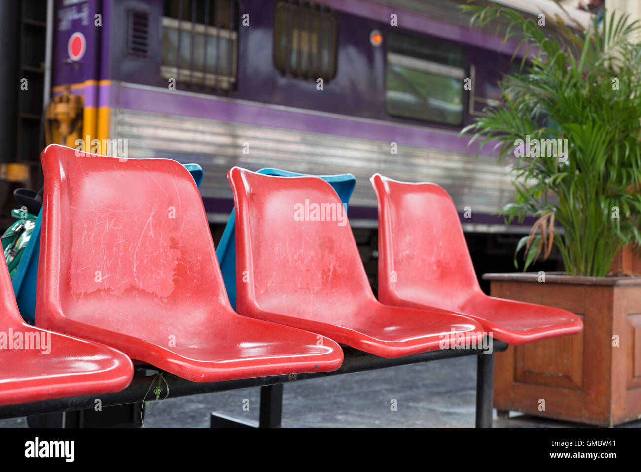 red plastic chair for passenger waiting for train at train station ...