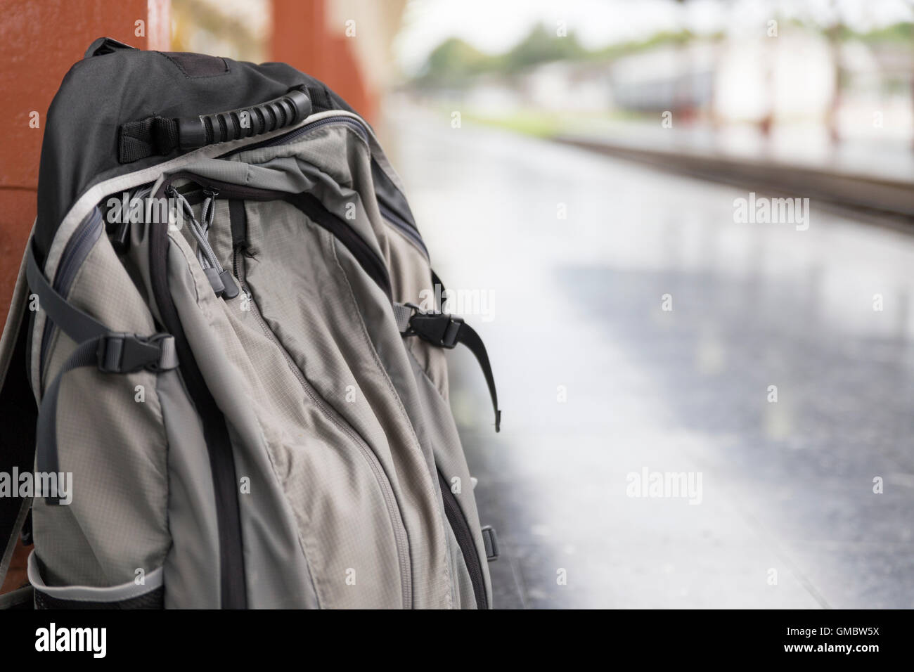 gray backpack on platform at train station - travel concept Stock Photo ...