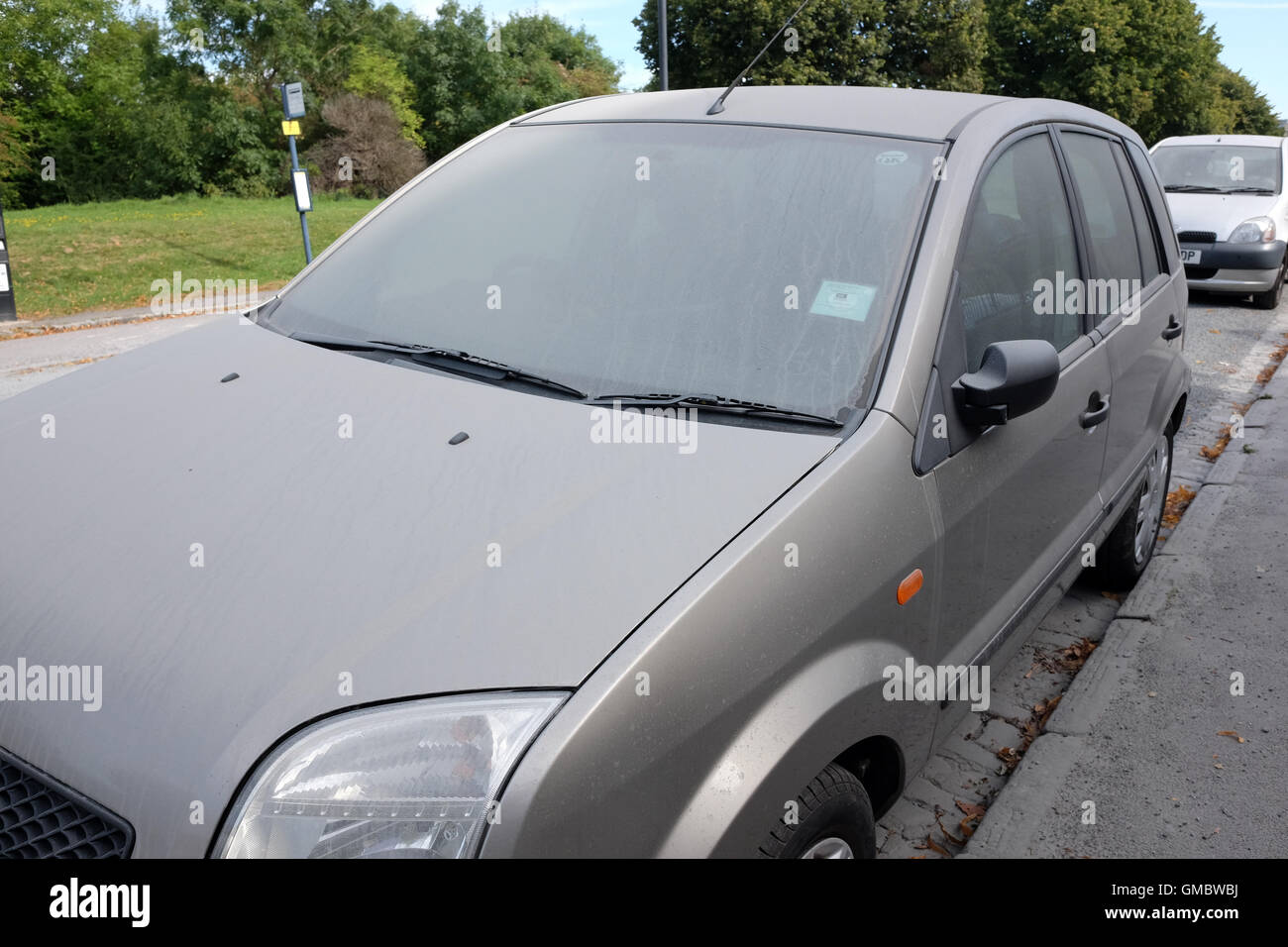 Very dirty and dusty cars parked where surface dressing has been taking ...