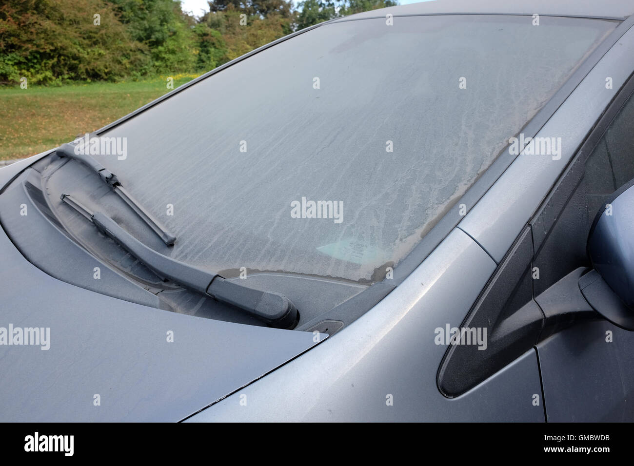 Very dirty and dusty cars parked where surface dressing has been taking ...
