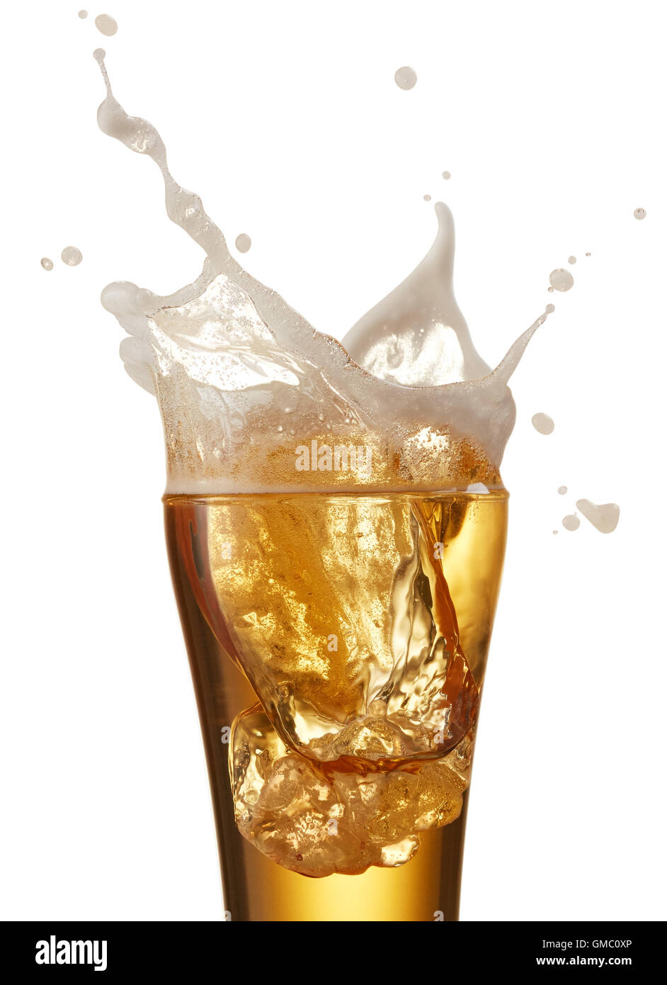 ice cube dropped into glass of beer creating splash Stock Photo - Alamy
