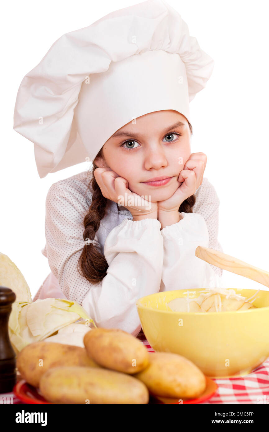 Beautiful little chief cooker on the desk with vegetables, isolated on ...