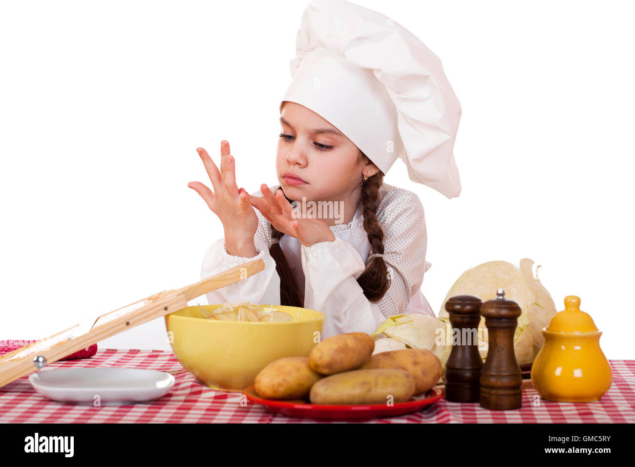 Beautiful little chief cooker on the desk with vegetables, isolated on ...