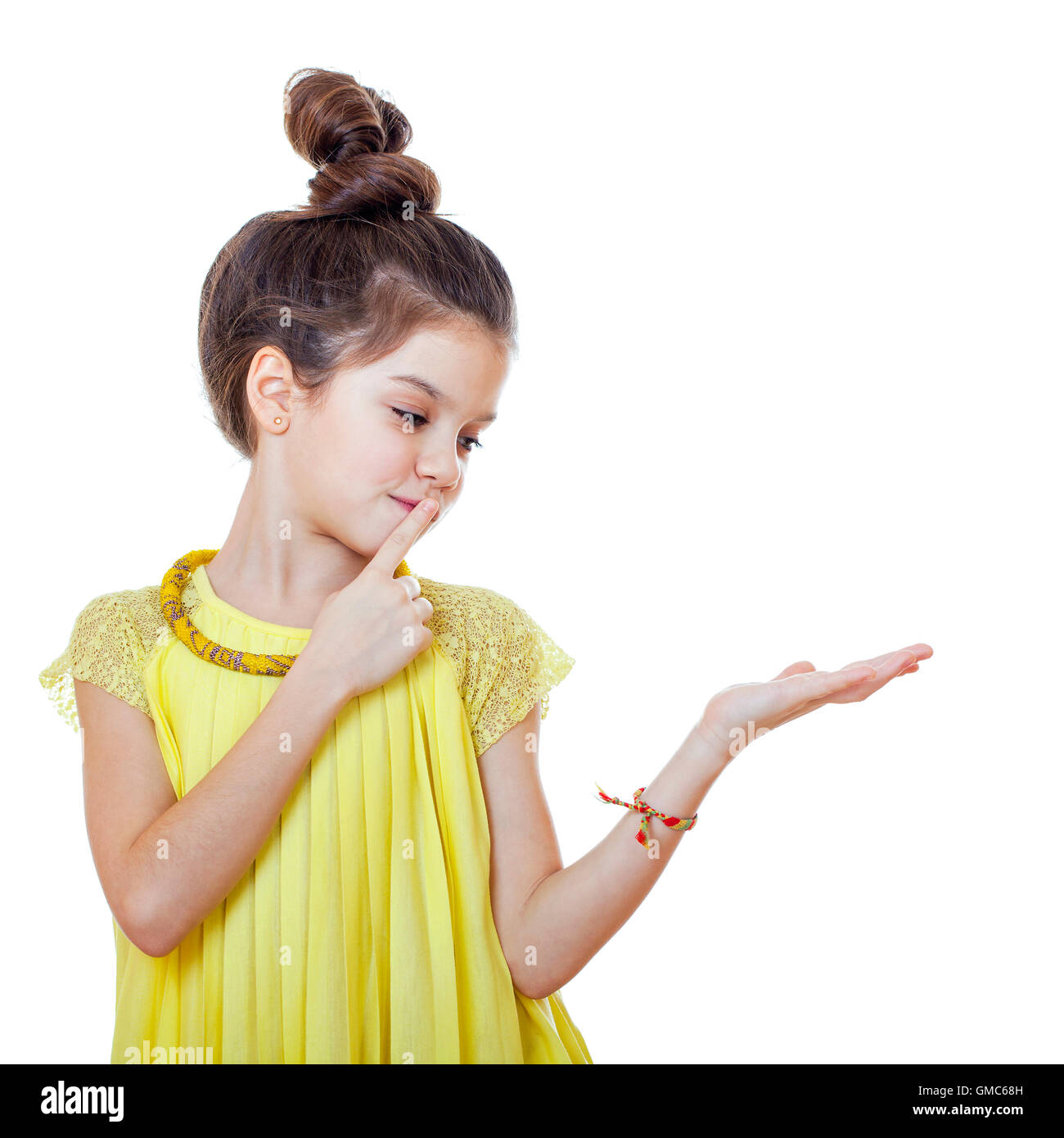 Beautiful youth little girl presenting copy space, studio on white ...