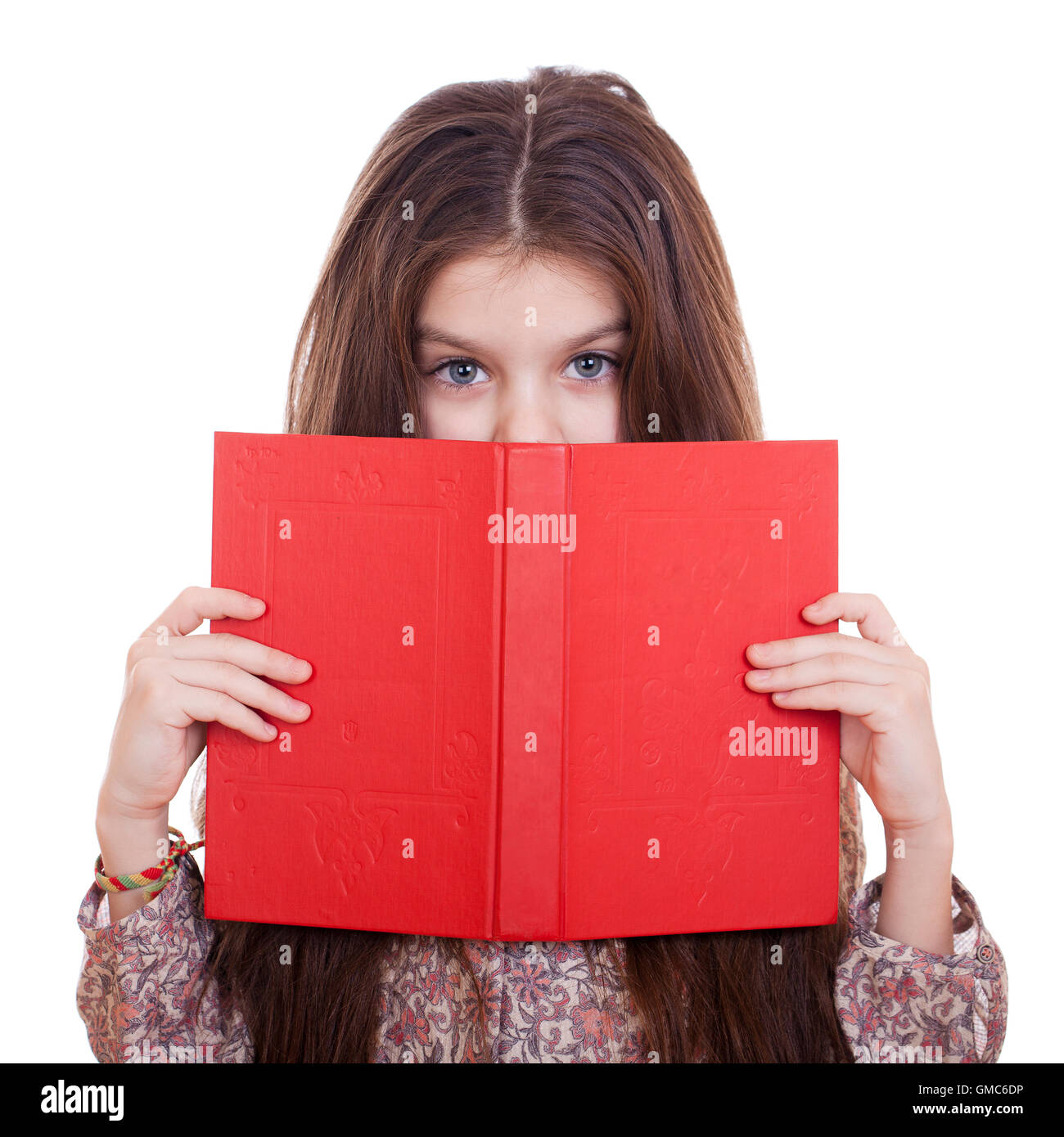 Little girl holding red book, studio on white background Stock Photo ...