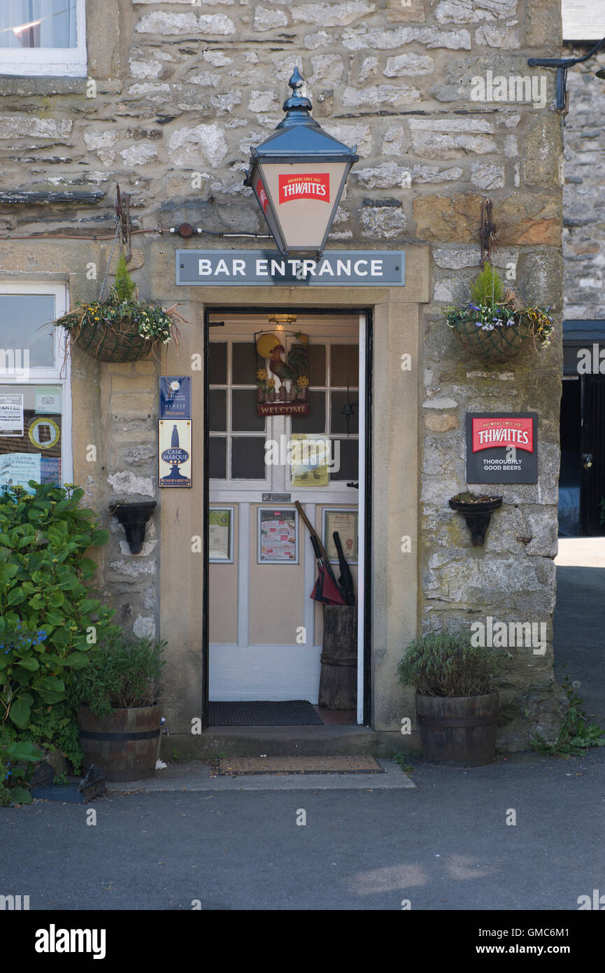 Bar entrance and open door of The Game Cock Inn - traditional Yorkshire ...