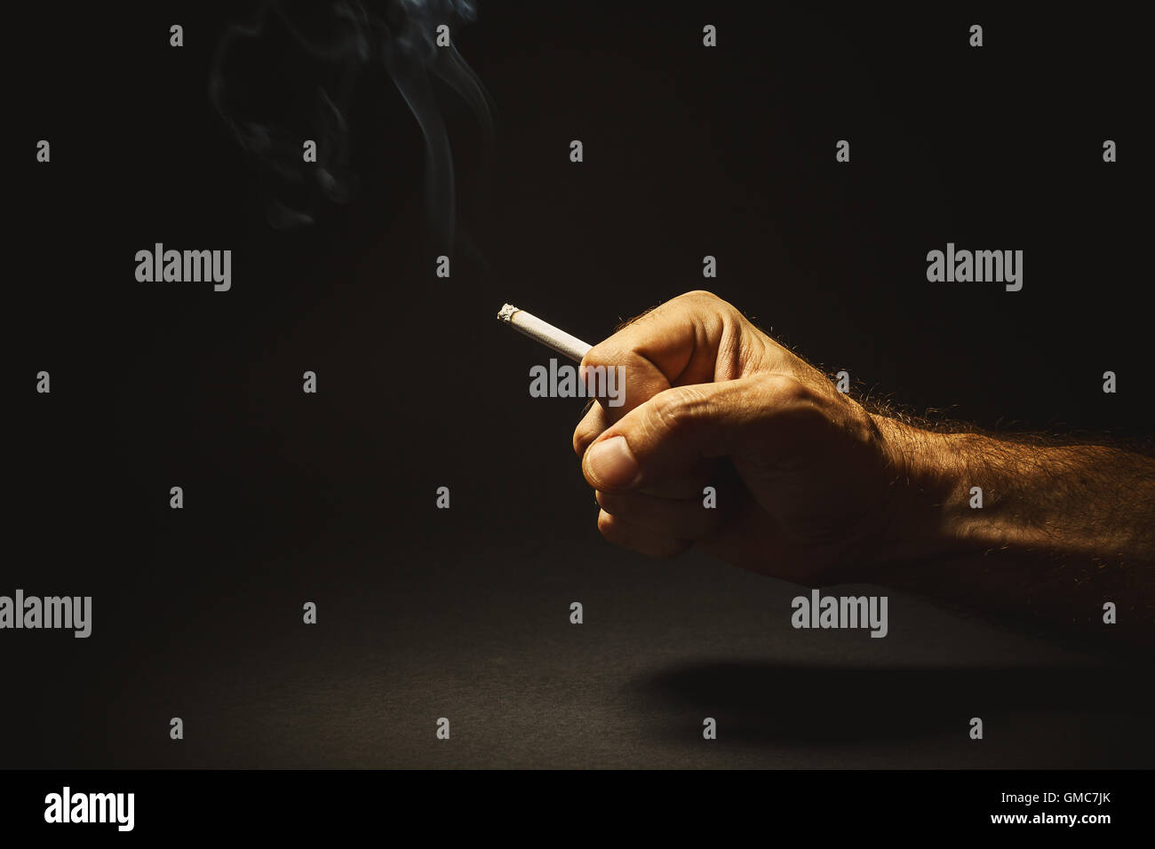 Hand holding cigar hi-res stock photography and images - Alamy