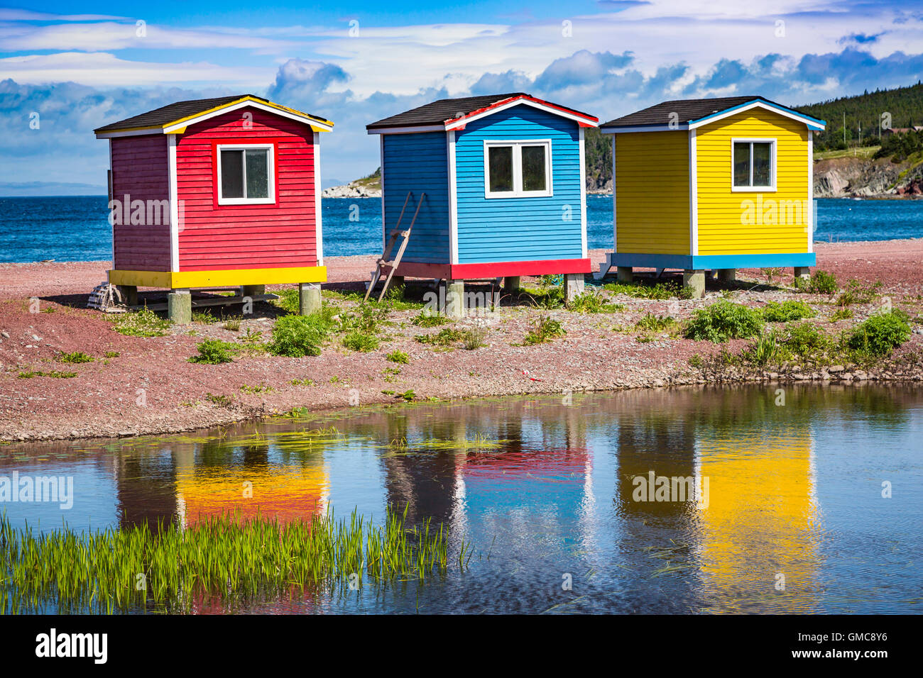 Colorful fishing stages with reflections at Cavendish, Newfoundland and ...