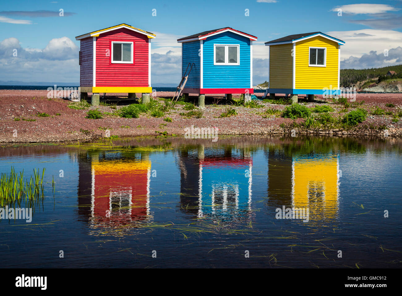 Colorful fishing stages with reflections at Cavendish, Newfoundland and ...