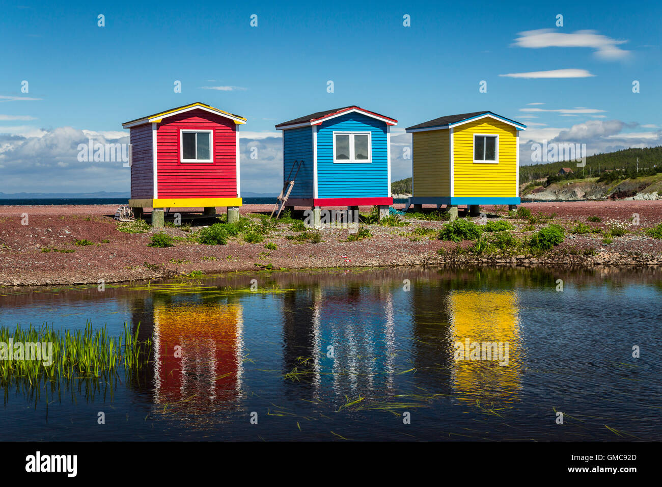Colorful fishing stages with reflections at Cavendish, Newfoundland and ...