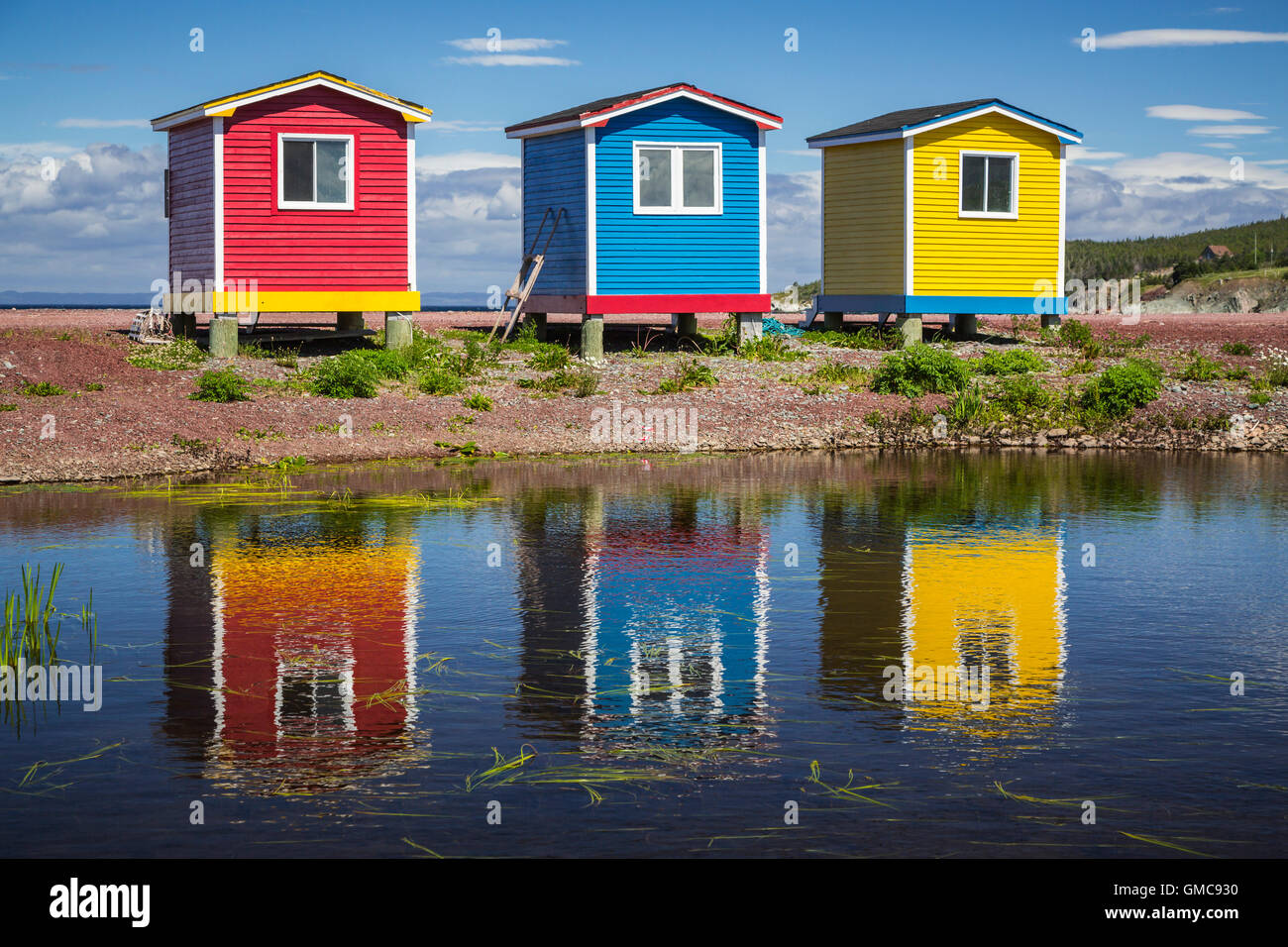 Colorful fishing stages with reflections at Cavendish, Newfoundland and ...