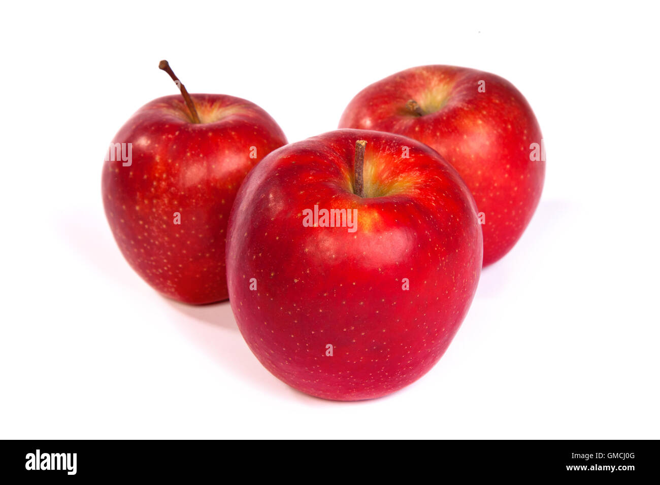 Three shiny red apples isolated on white Stock Photo - Alamy