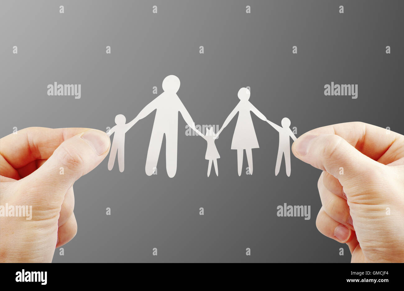 paper family in hands Stock Photo - Alamy