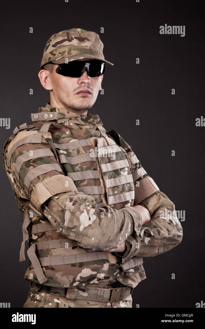 Military man on a black background Stock Photo - Alamy