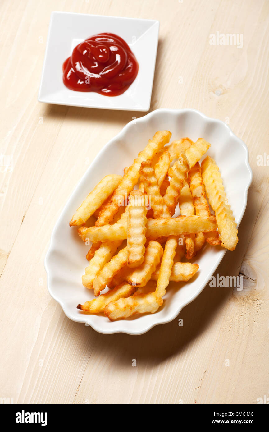 french fries on a typical plate Stock Photo - Alamy