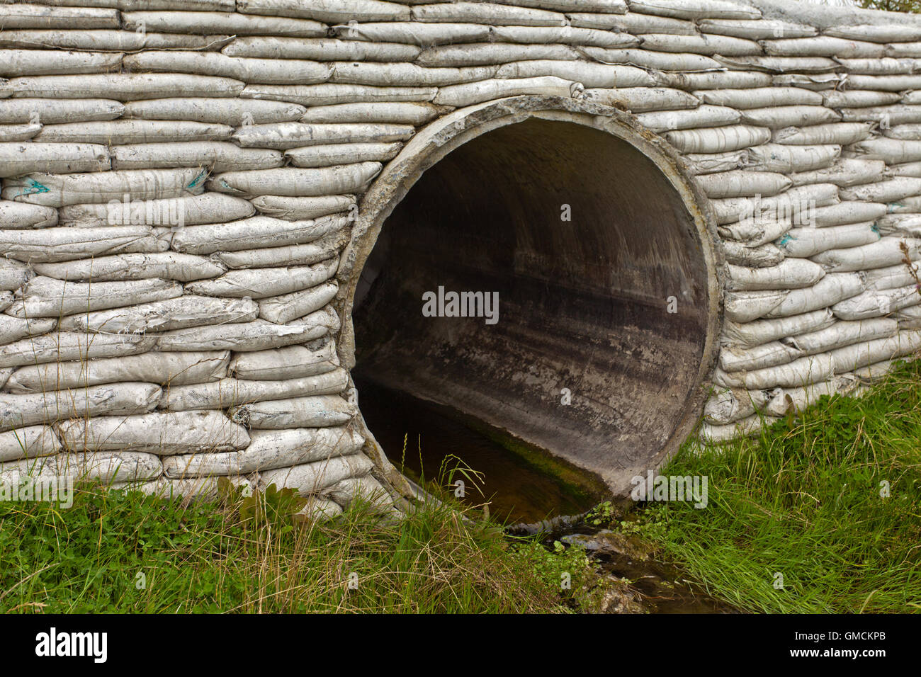 Storm culvert drainage pipe concrete revetment Stock Photo - Alamy