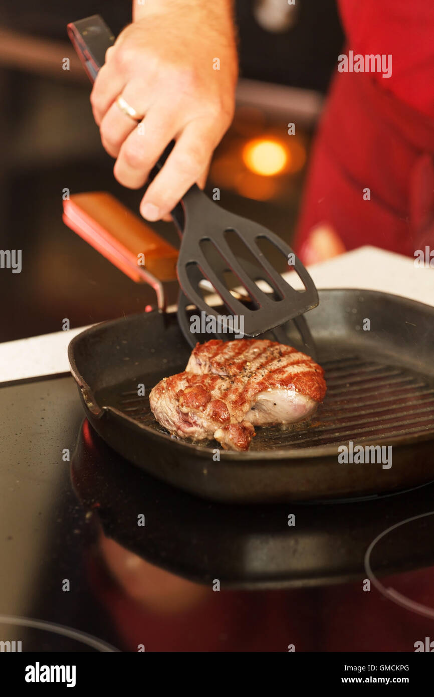 beef steak in a frying pan Stock Photo - Alamy