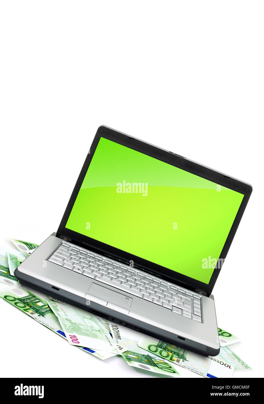 Open laptop with money Stock Photo - Alamy